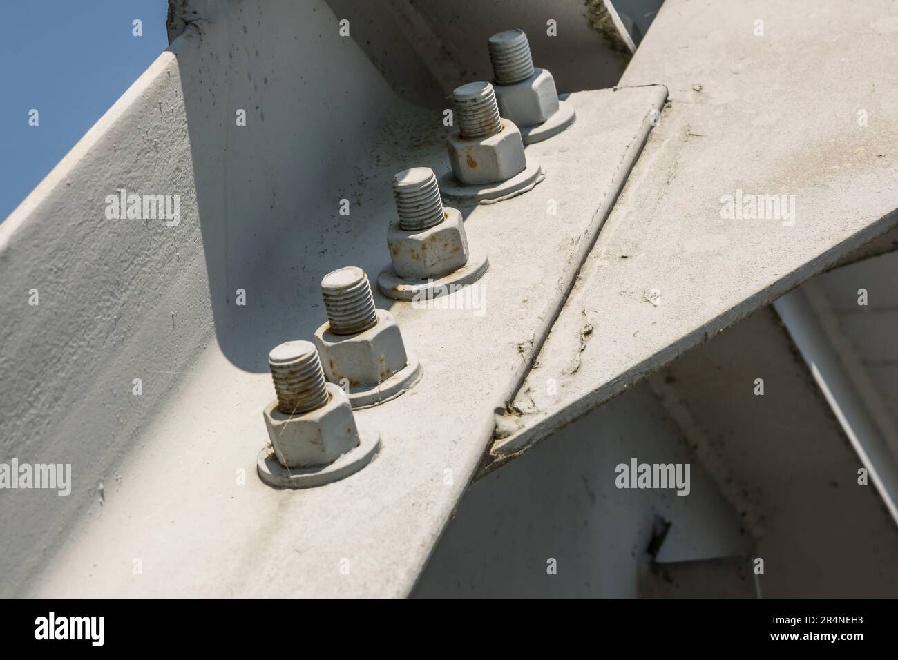 Bolts and nuts on metal plates of steel structure of heavy duty ...