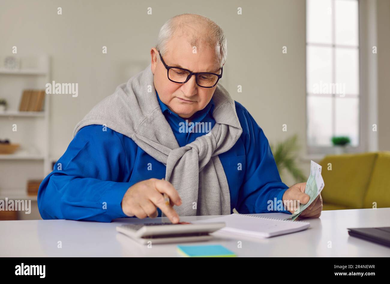 Old man calculating paper hi-res stock photography and images - Alamy
