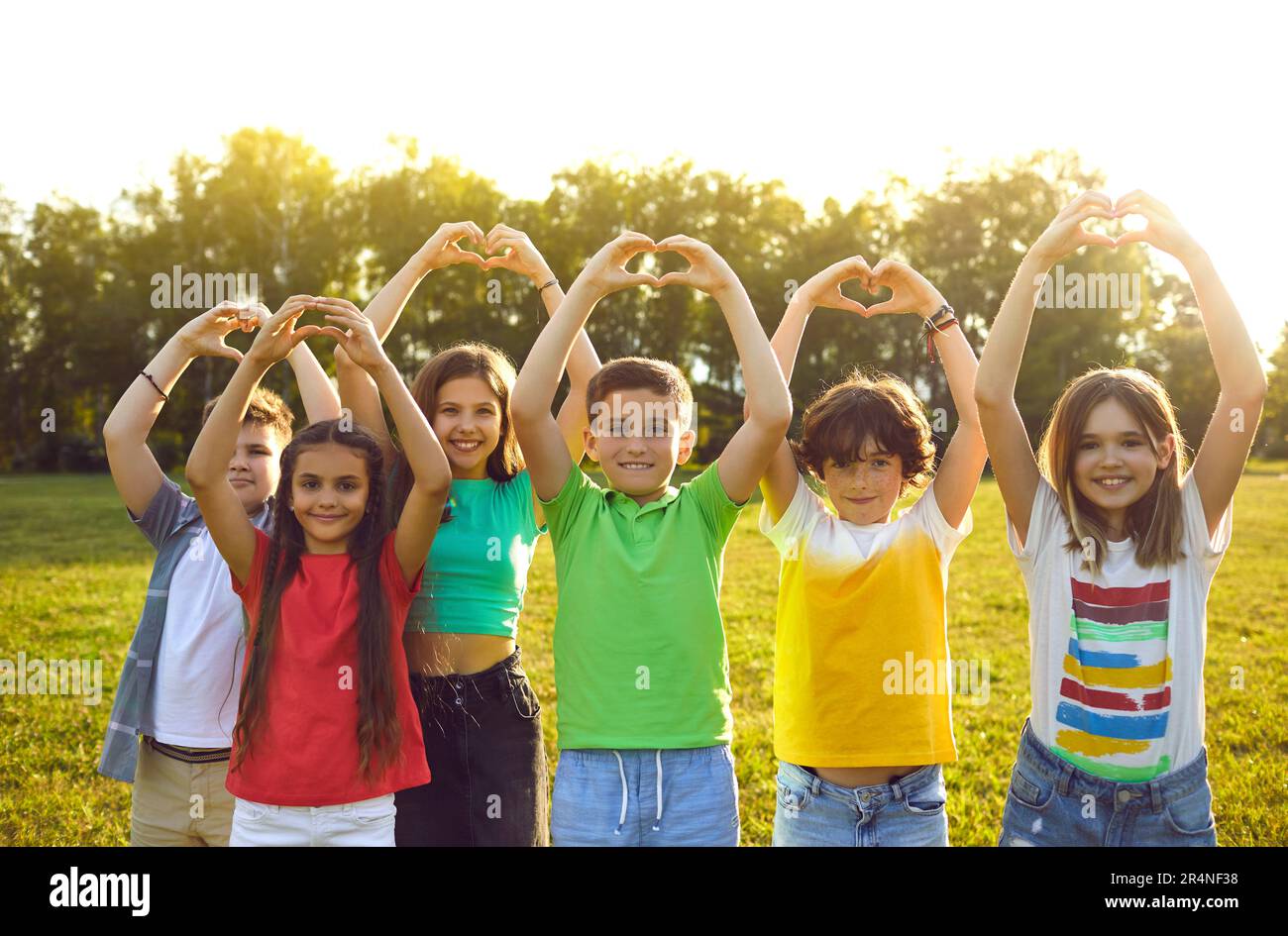 Group of happy children wishing for world peace, smiling and doing ...