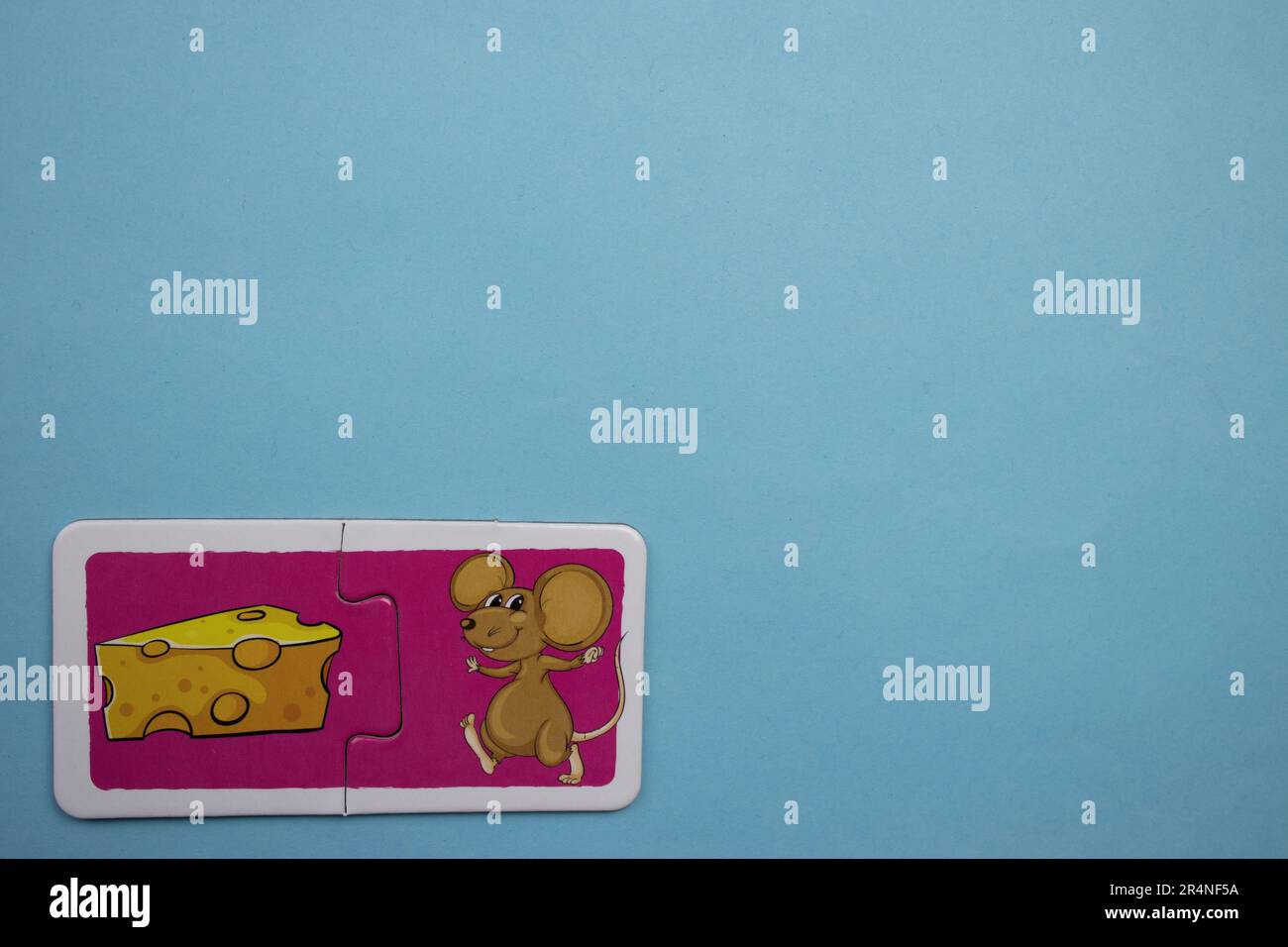 Picture puzzles placed on the edge of a blue background. Mouse and ...
