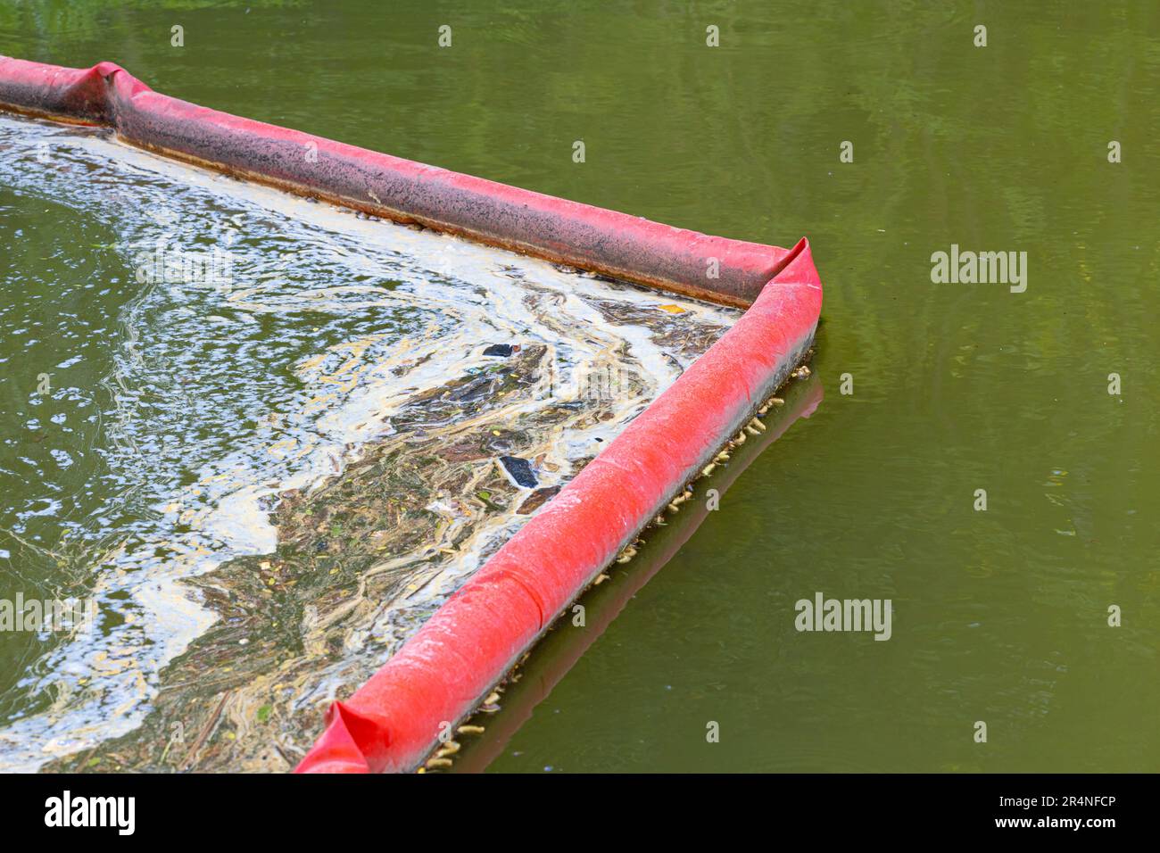 cleaning the pond from floating debris and sewage. mechanical cleaning ...