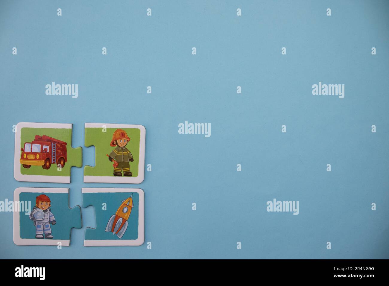 Picture puzzles placed on the edge of the blue background. Astronaut ...