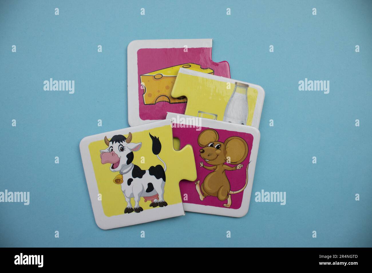 Information puzzles placed on a blue background. Cow, mouse, milk and ...