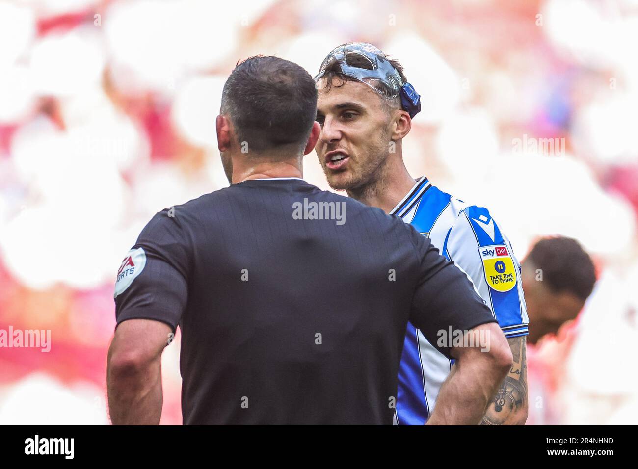 Lee Gregory #9 of Sheffield Wednesday speaks to Referee Tim Robinson ...