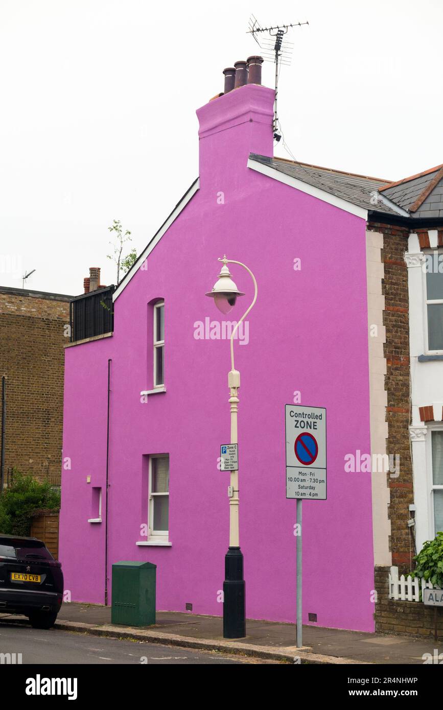 Gable end, rendered and painted purple / pink / lilac with bright paint ...