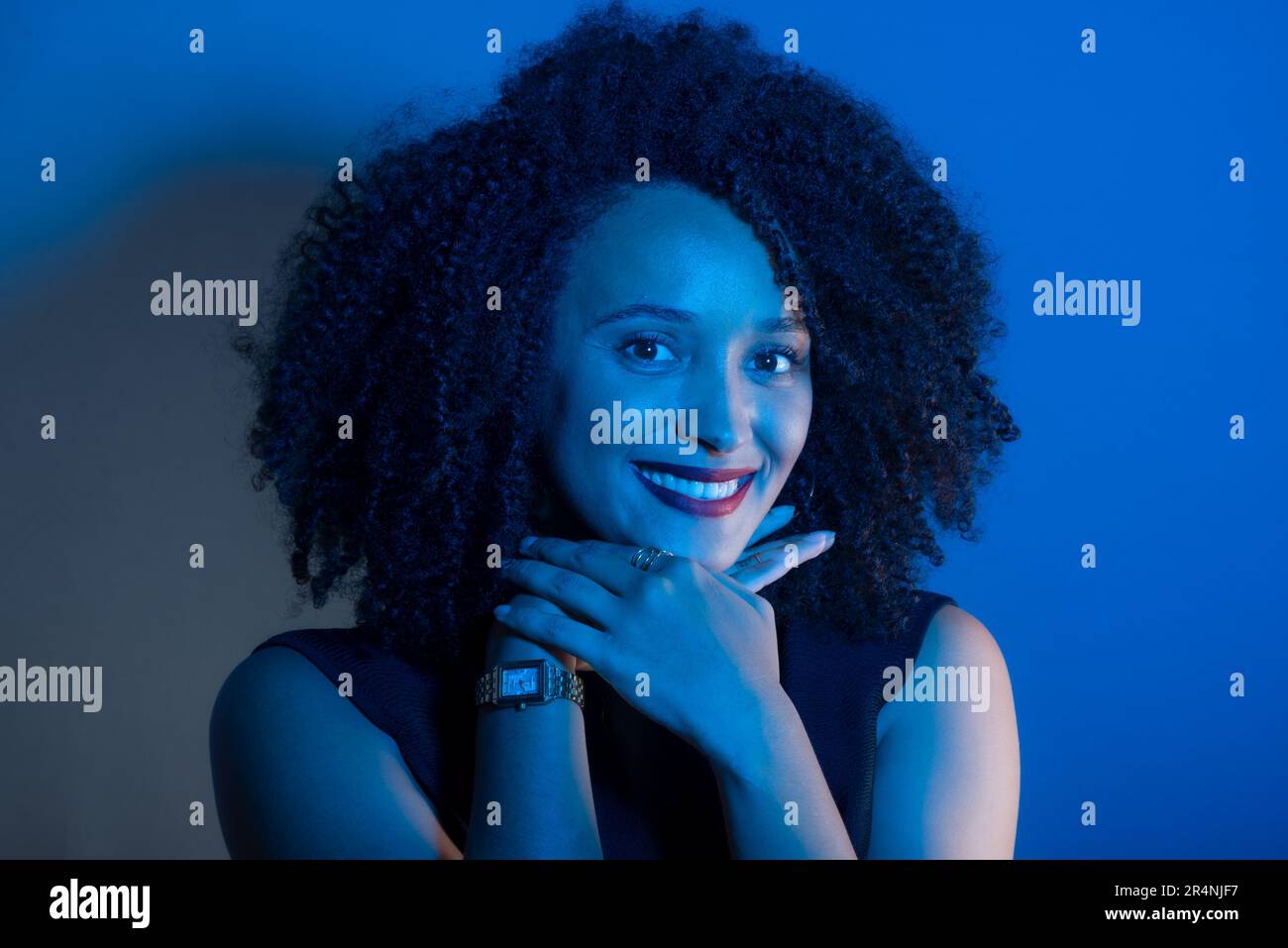 Close-up portrait of beautiful young woman making hand gestures ...