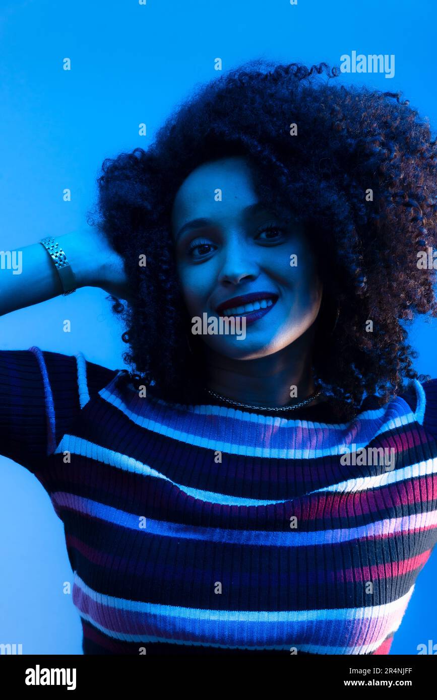 Close-up portrait of beautiful young woman making hand gestures ...