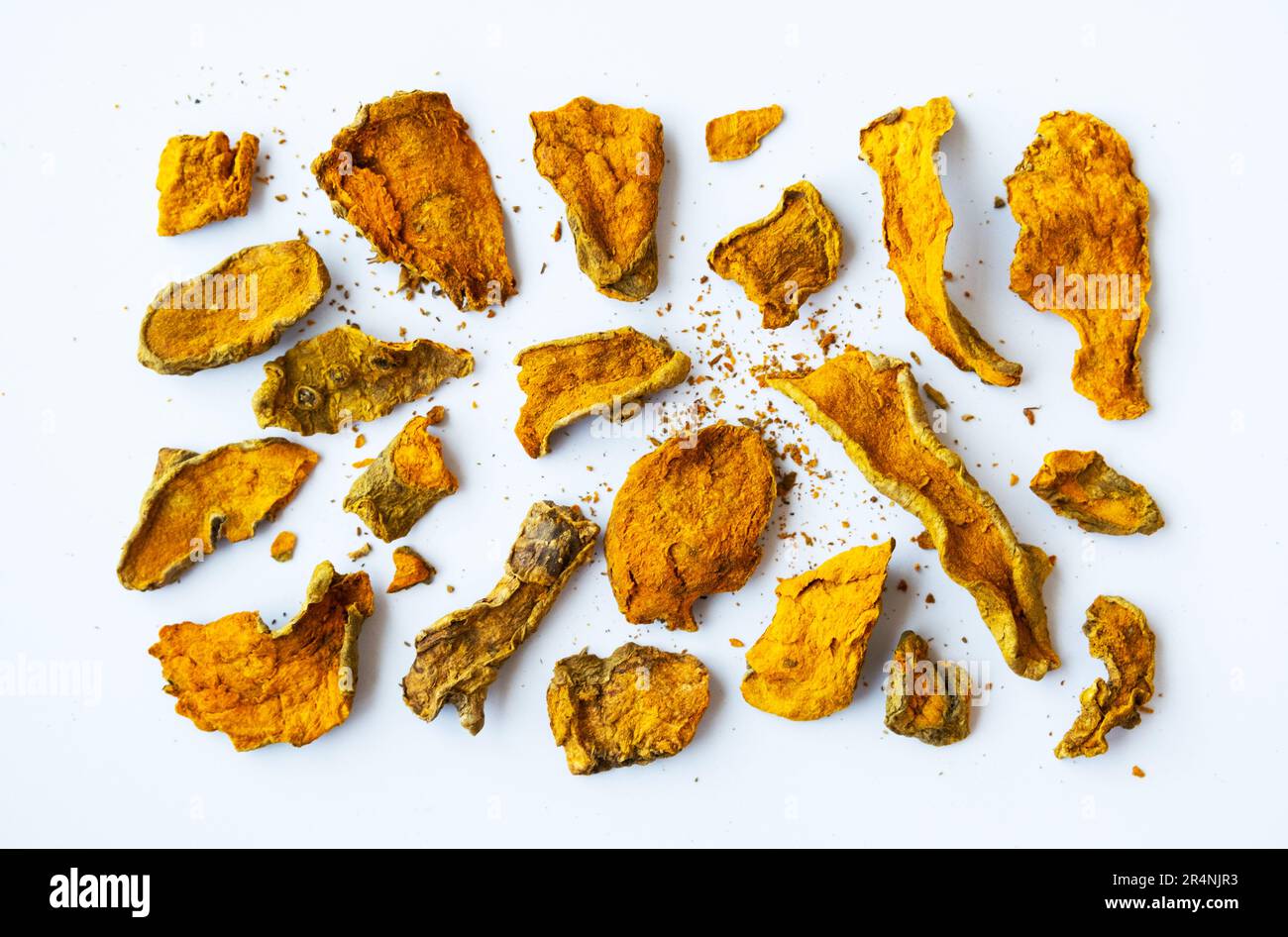 Sliced dried turmeric root. Curcuma spice used for homeopathic ...