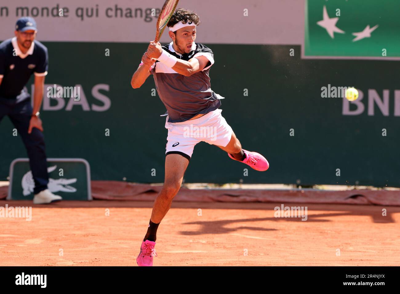 Paris, France. 28th May, 2023. Emilio Nava of the US returns the ball to Spaniard Roberto ...