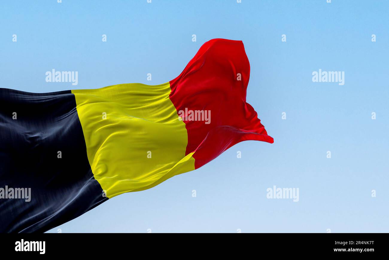 The national flag of Belgium waving on a clear day. Three equal ...