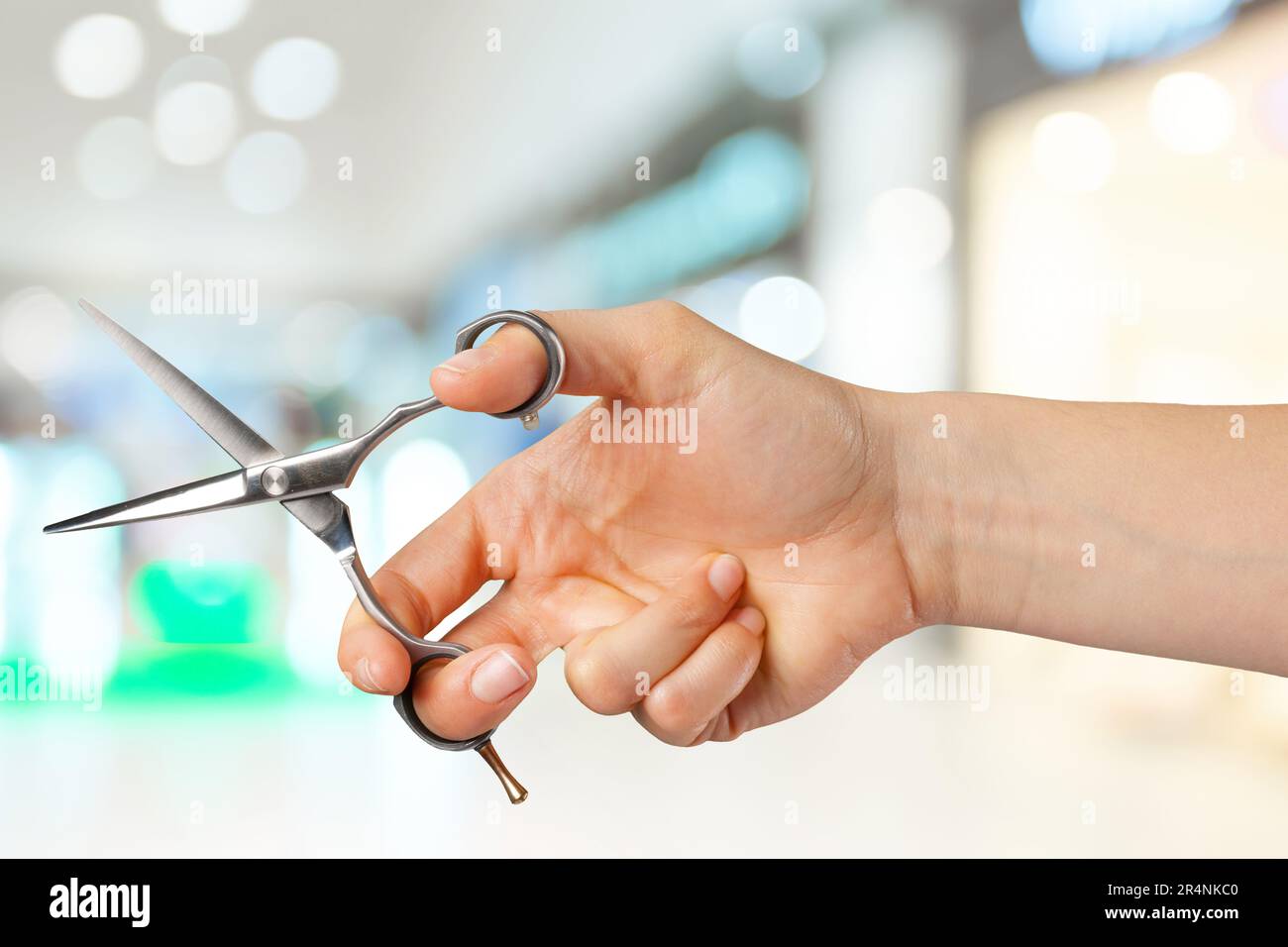 woman's hand holding scissors Stock Photo - Alamy