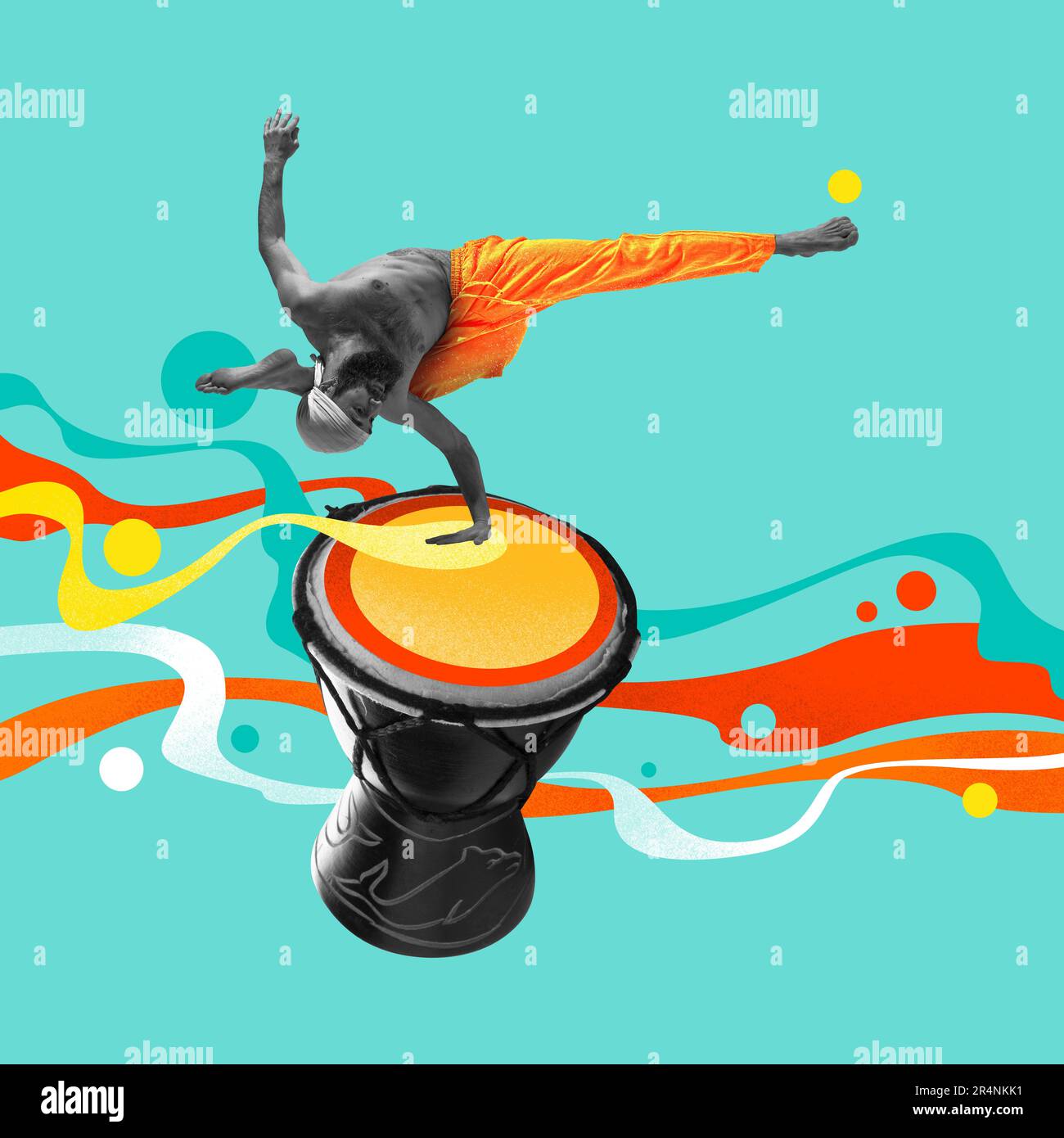 Young artistic man, hip-hop dancer dancing on giant djembe drums over ...