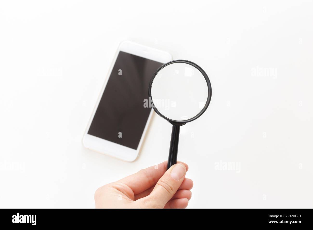 SMARTPHONE WITH MAGNIFYING GLASS Stock Photo - Alamy