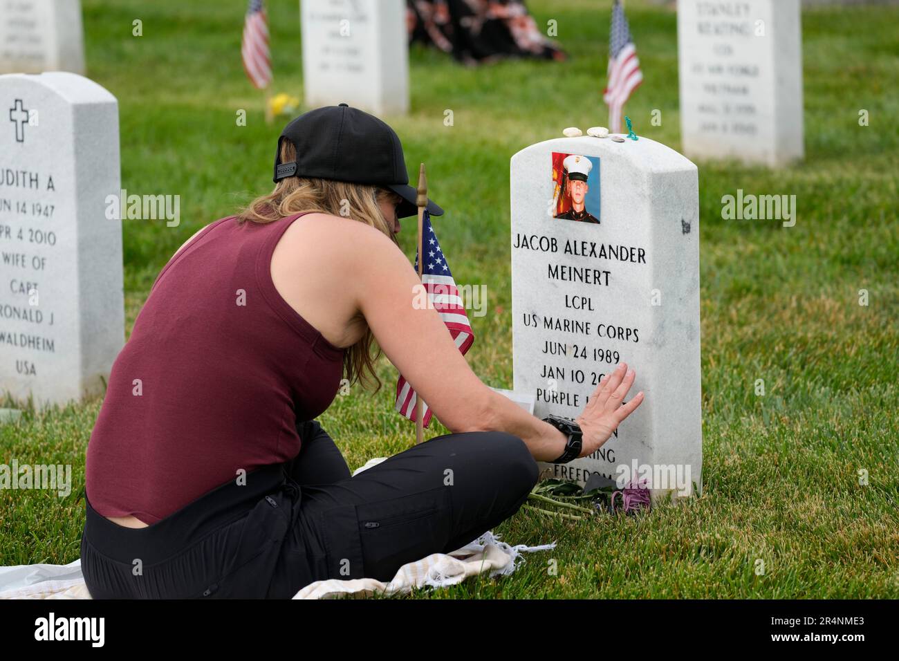 Krista Meinert touches the headstone of her son U.S. Marine Corps Lance ...