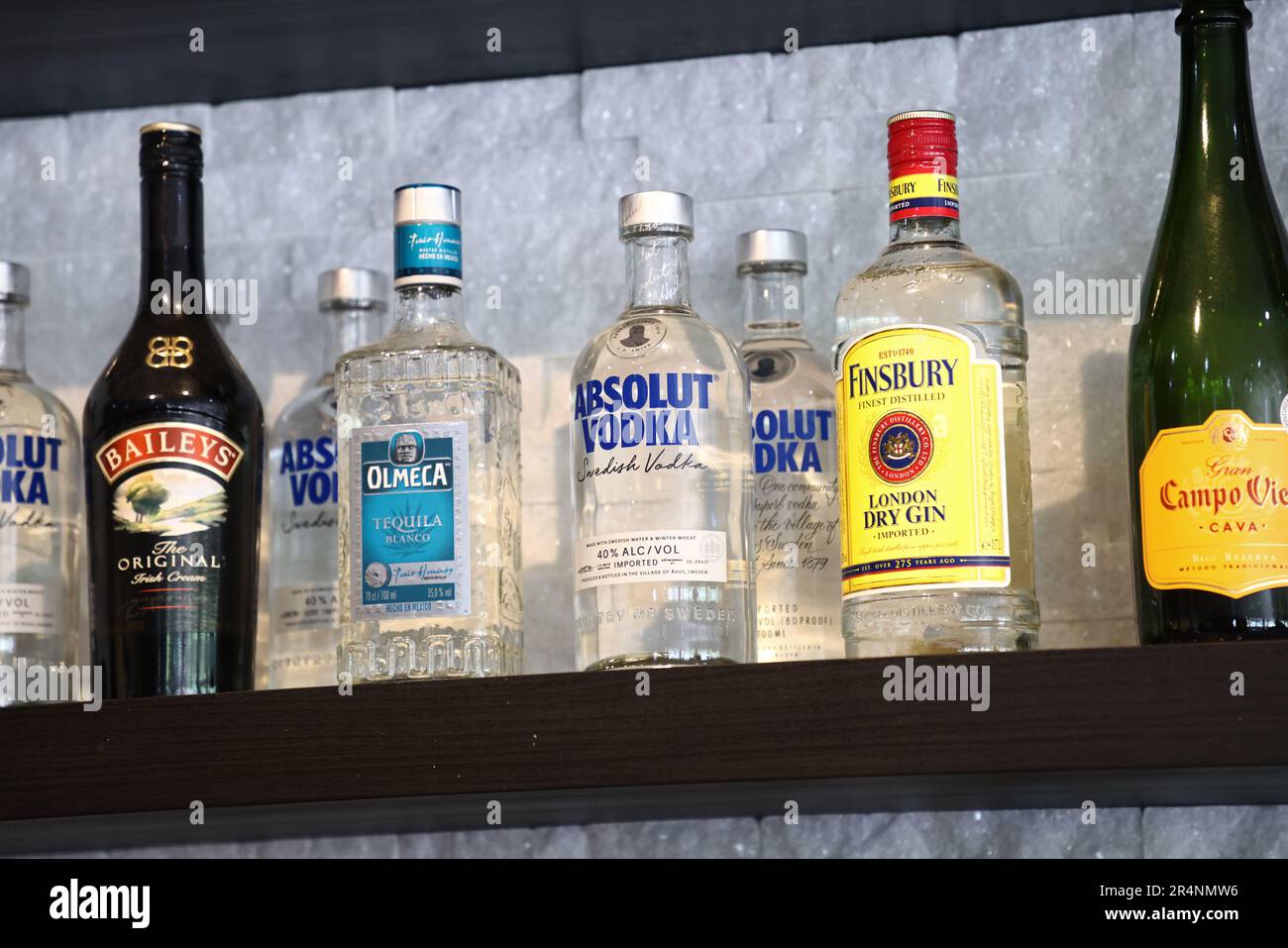 Liquor bottles at a restaurant including Absolut vodka Stock Photo - Alamy