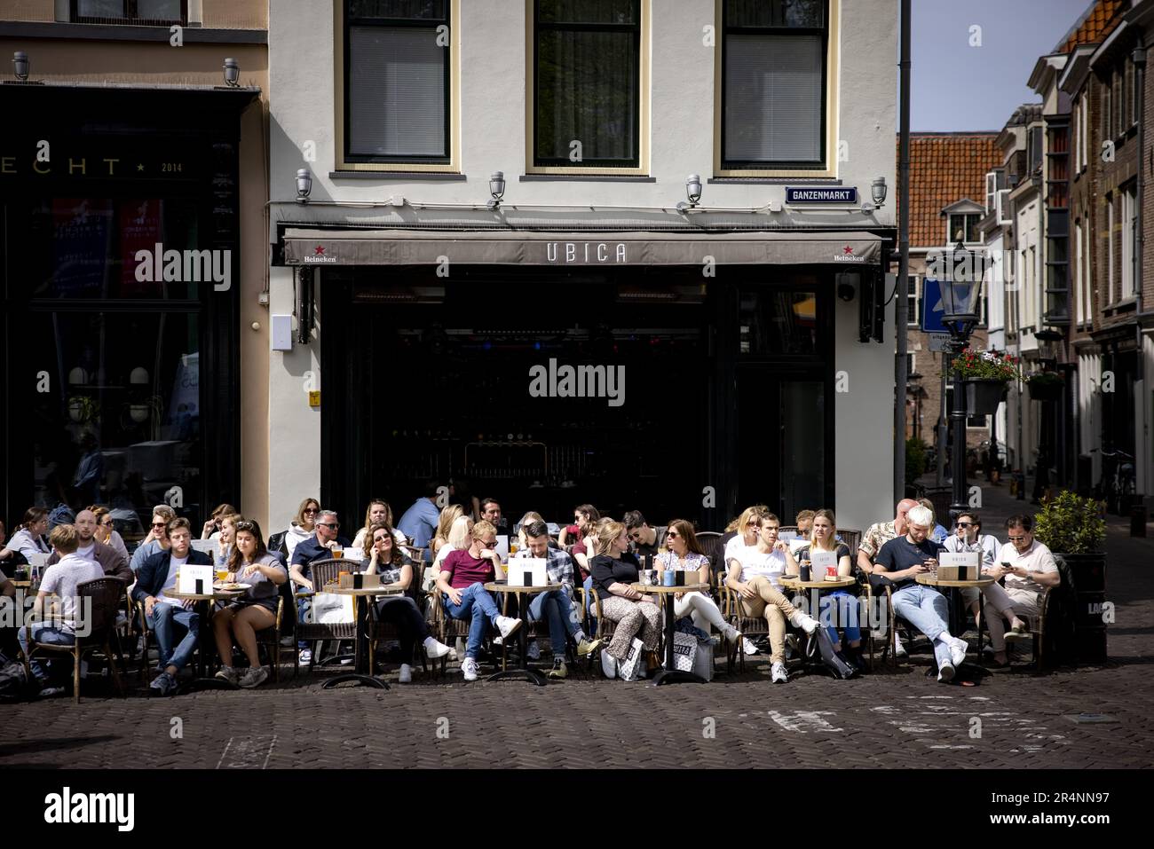 UTRECHT - Day trippers sit on the terrace on Whit Monday. Many people ...