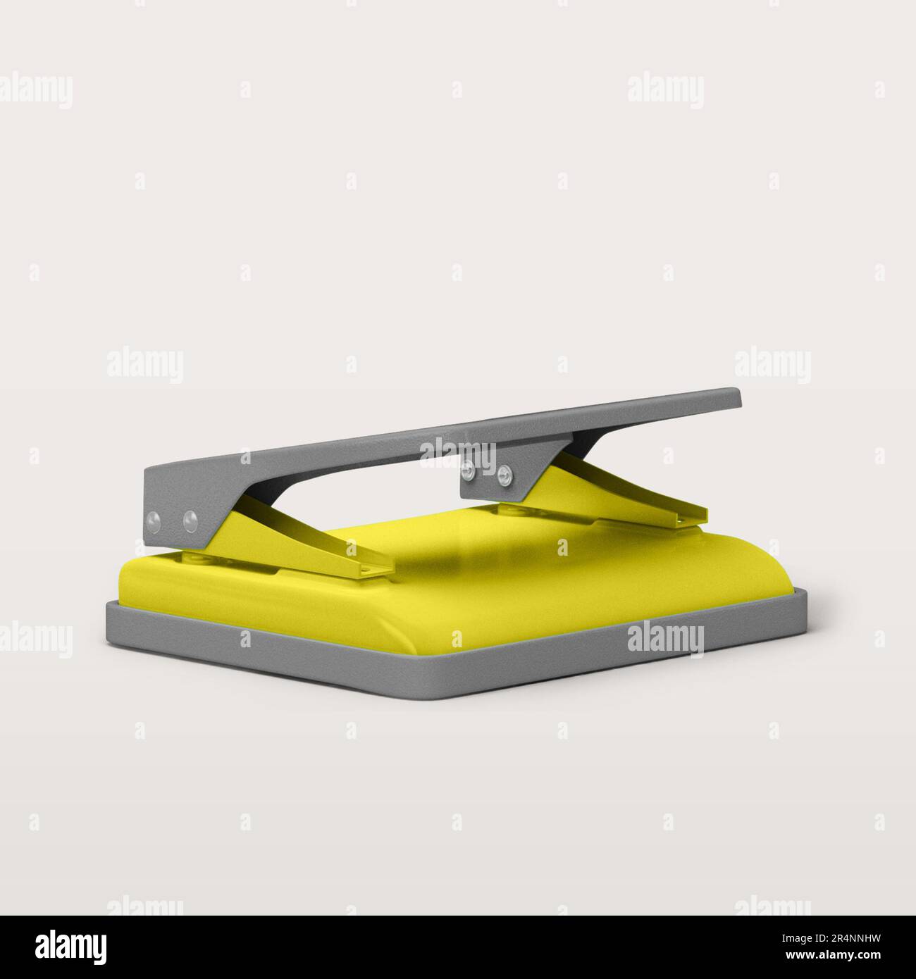 Close up view yellow holepuncher on white background Stock Photo - Alamy