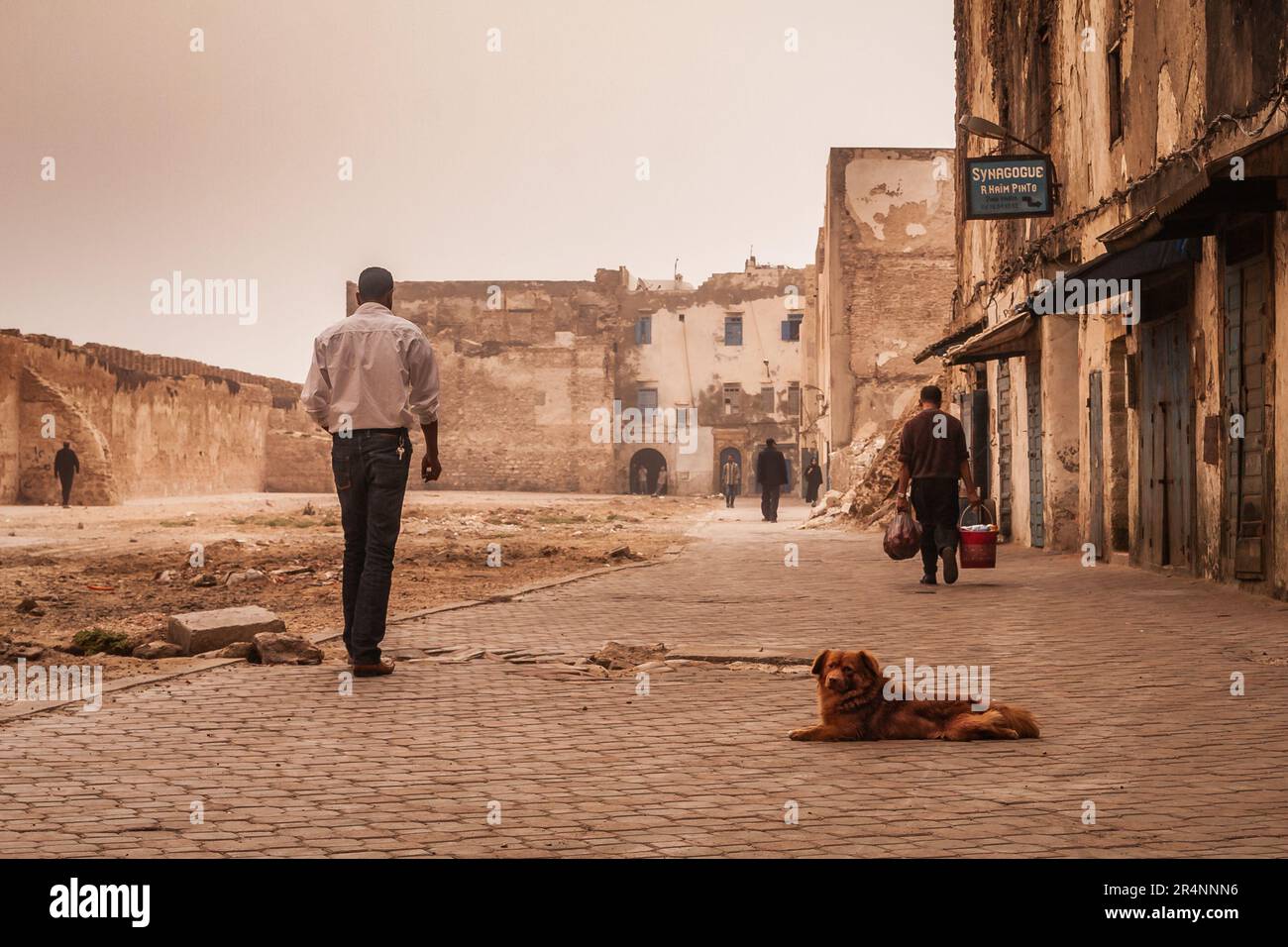 Passage in a large square in the old part, a sign indicates the ...