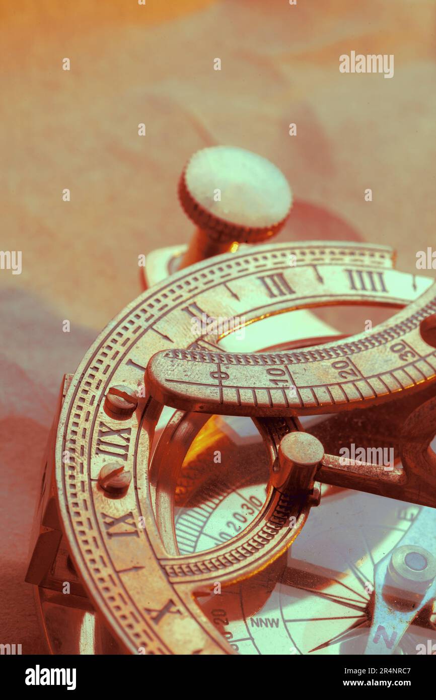 antique compass on vintage paper background Stock Photo - Alamy