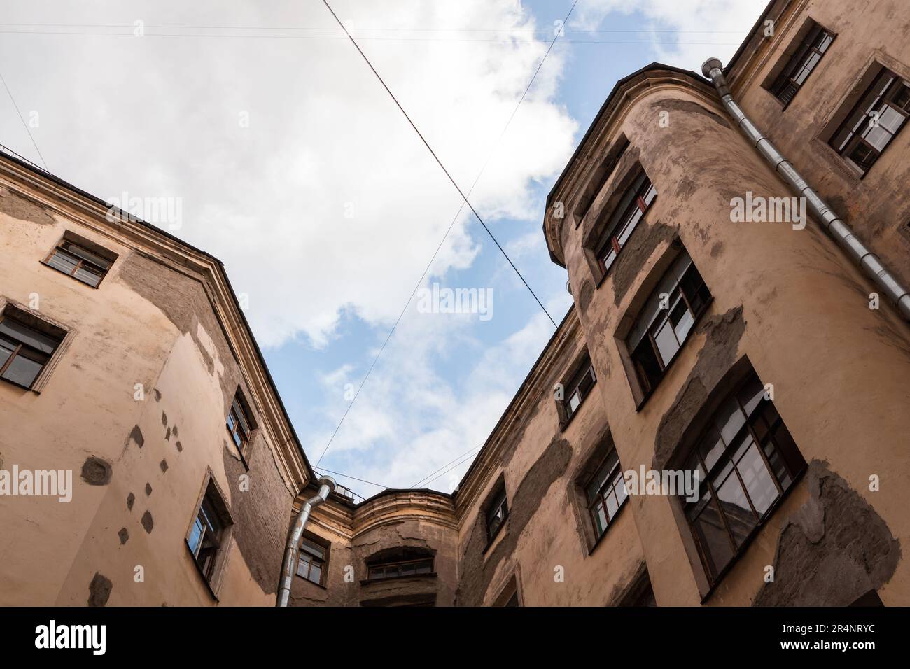 Inner courtyard view, old yellow residential houses of Saint-Petersburg ...