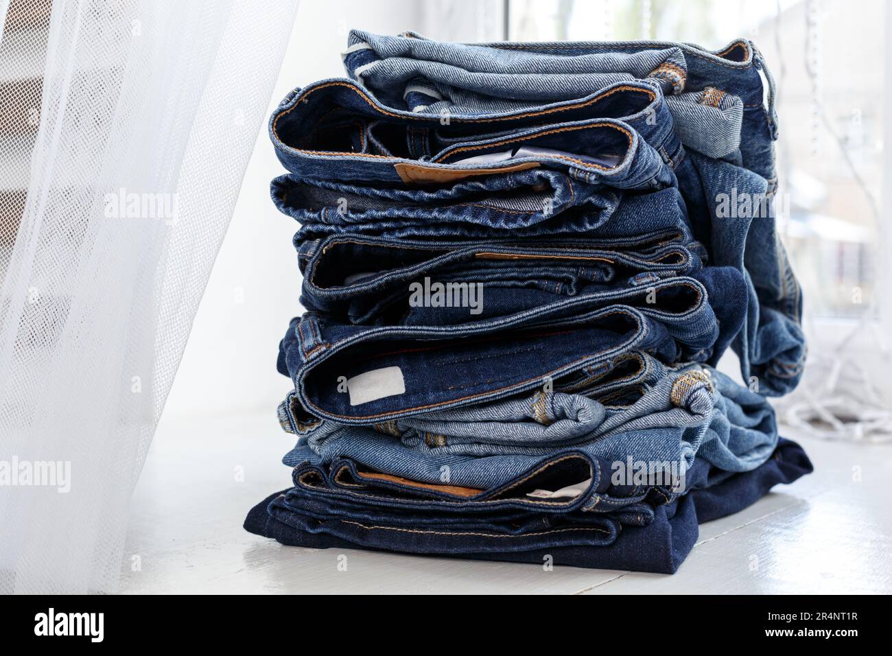 Pile of jeans Stock Photo - Alamy