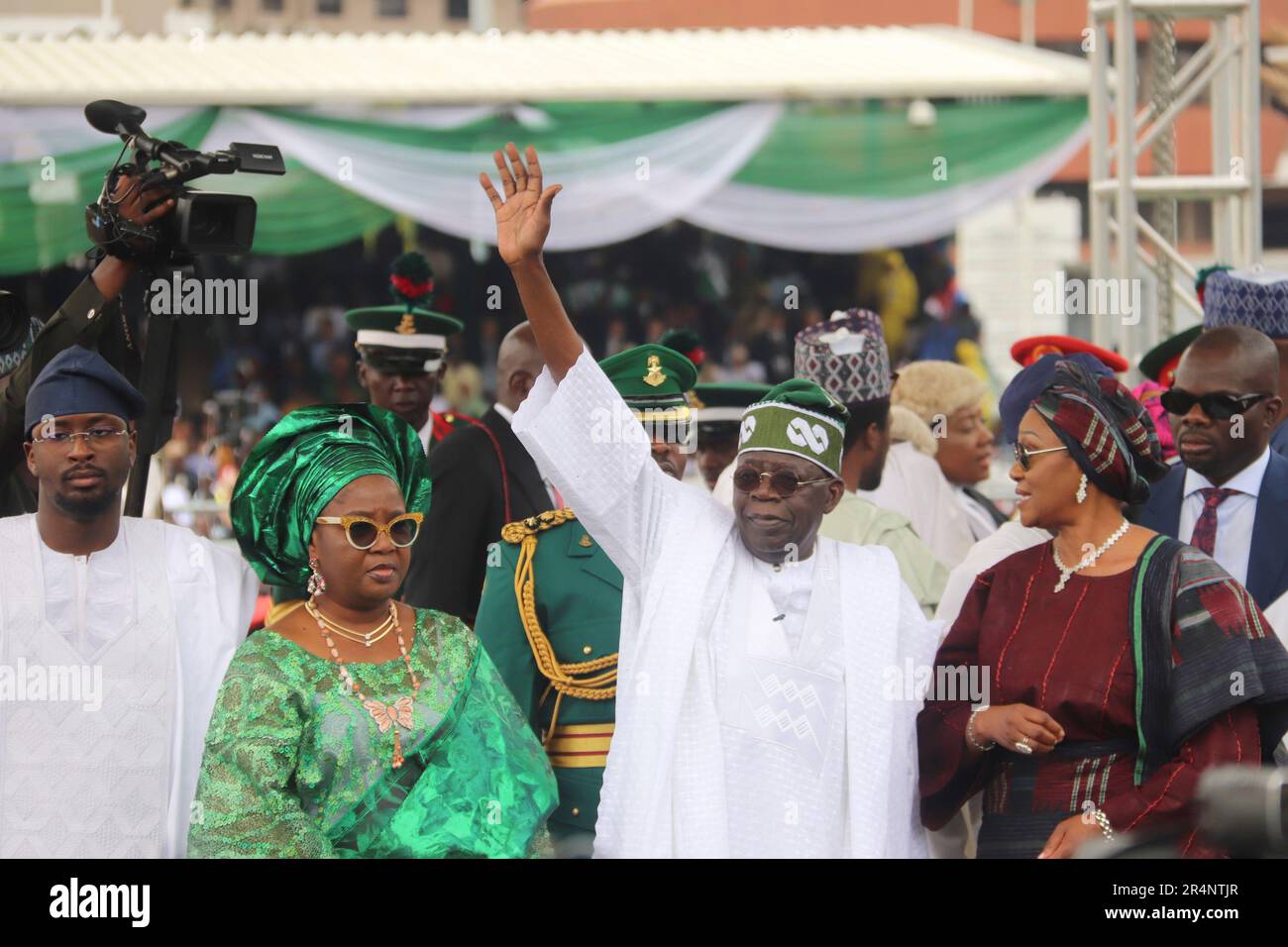 Nigeria's new President Bola Ahmed Tinubu, inspects honour guards after taking an oath of office ...