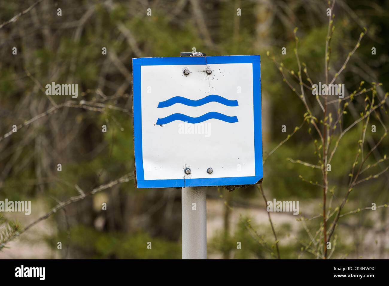 Groundwater area sign with blue waves, close up Stock Photo - Alamy