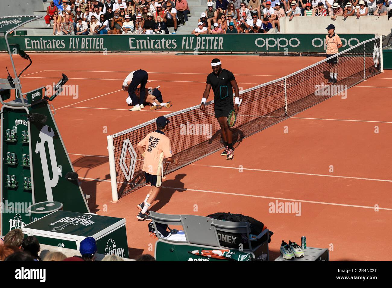 Chair Umpire Timo Janzen of Germany, rear, tends to Serbia's Filip ...