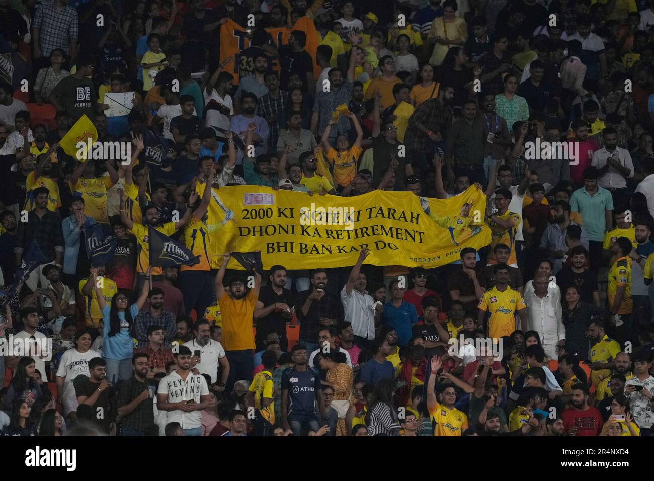 Fans of Chennai Super Kings' captain MS Dhoni display a banner during ...