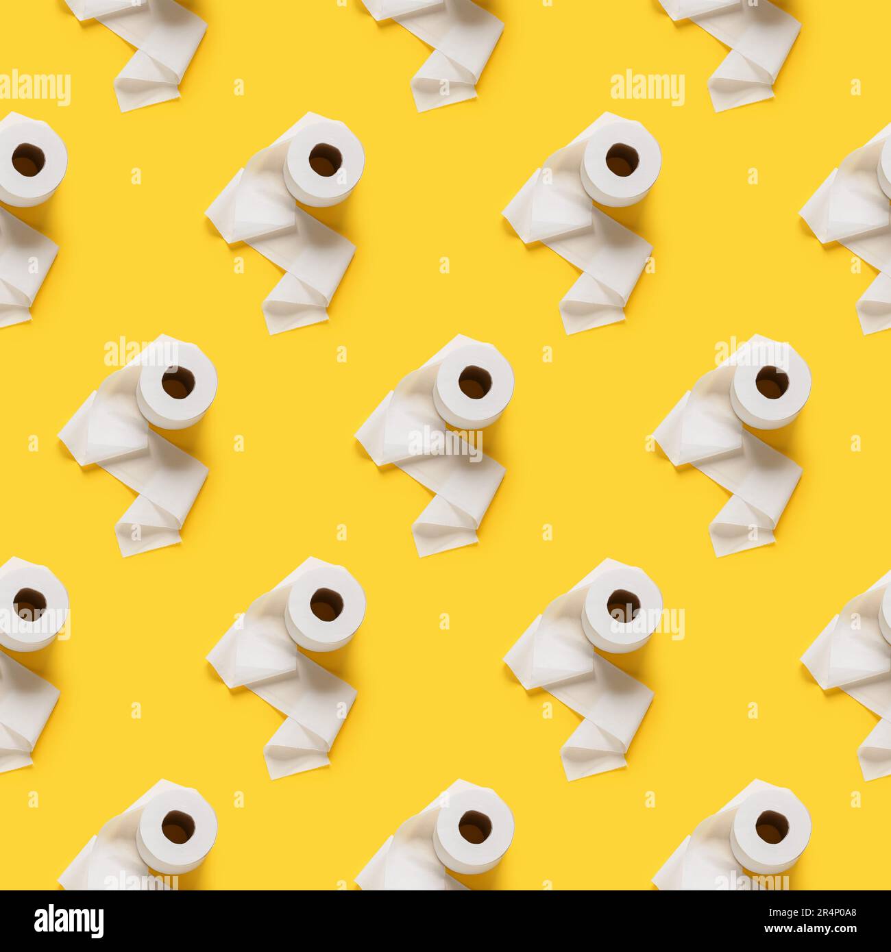 Many toilet paper rolls on yellow background. Pattern for design Stock ...