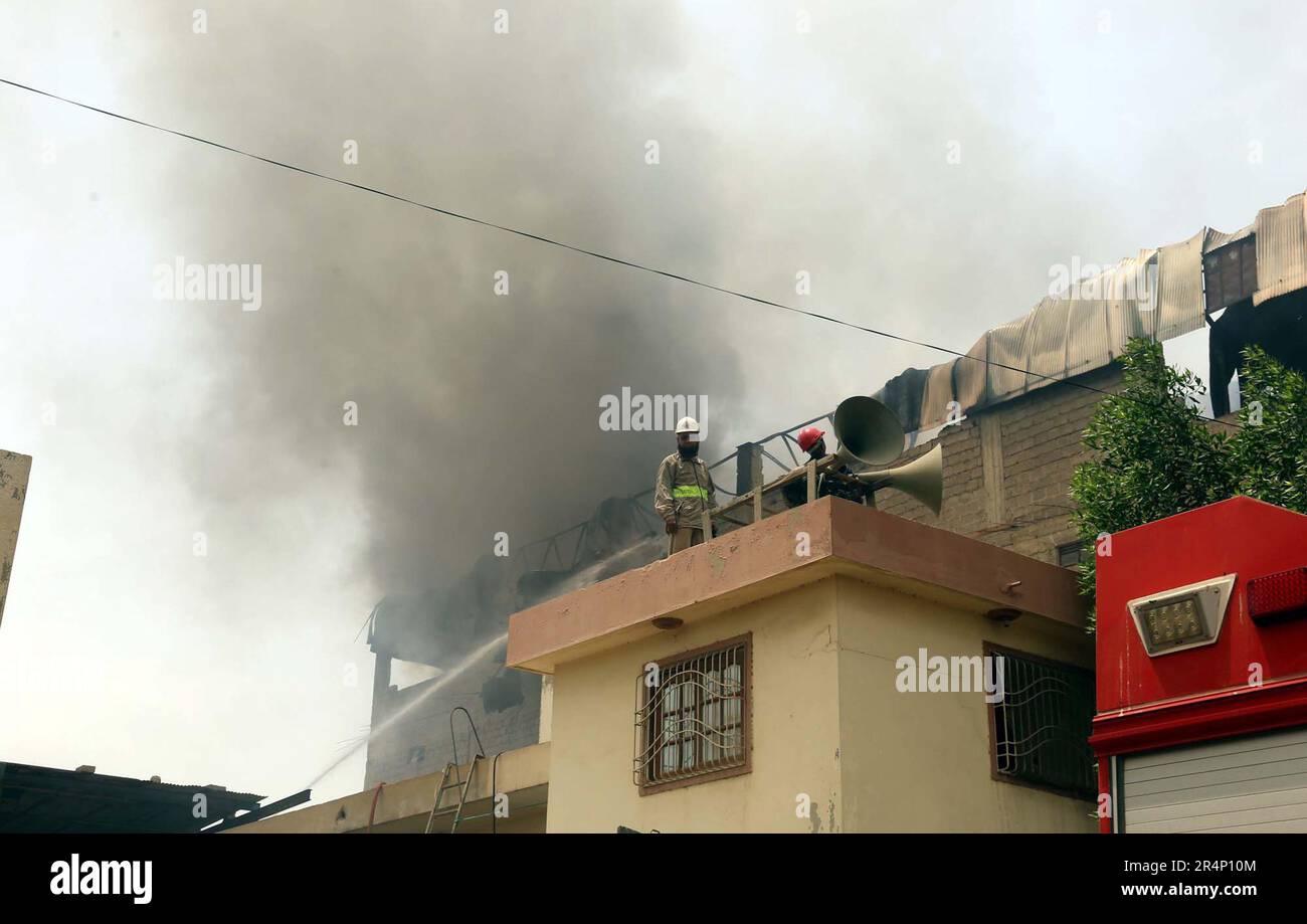 Smoke fumes can be seen rising from a fire that erupted at a plastics ...