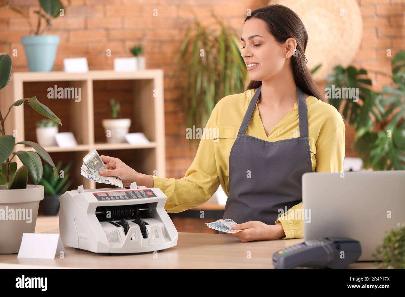 Woman euro banknotes using hi-res stock photography and images - Alamy