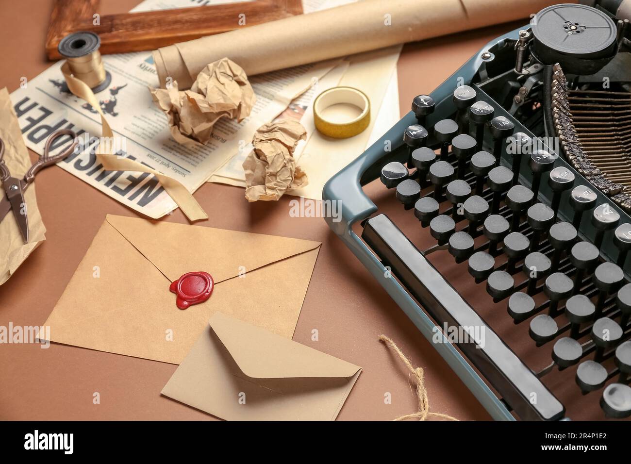 Composition with vintage typewriter, envelope and crumpled paper on ...