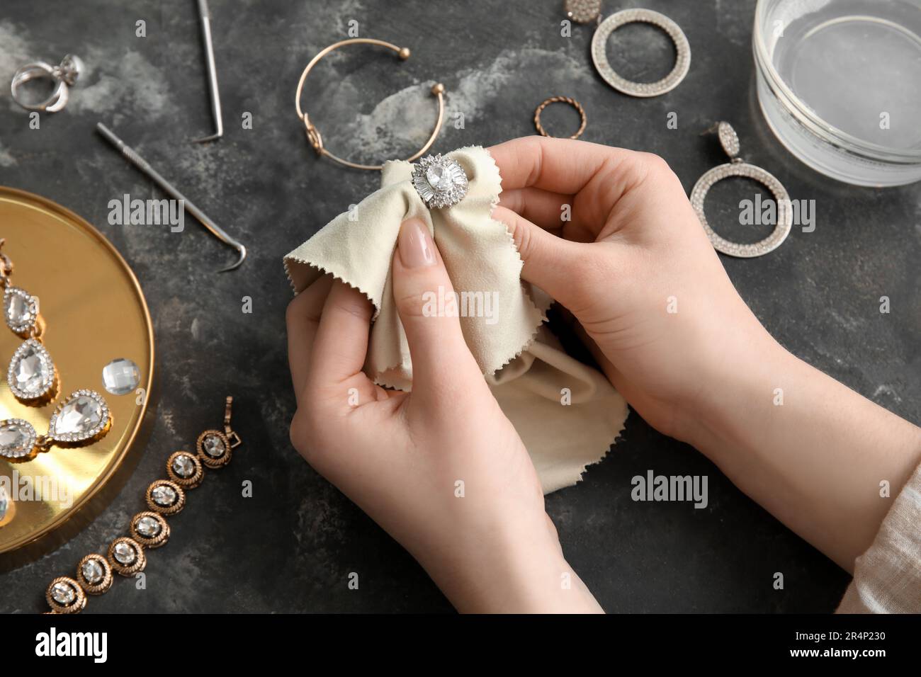 Woman polishing jewellery hi-res stock photography and images - Alamy