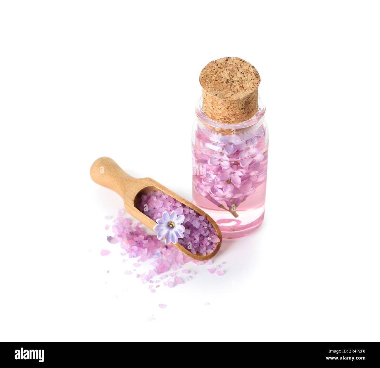 Bottle of cosmetic oil with beautiful lilac flowers and sea salt on ...