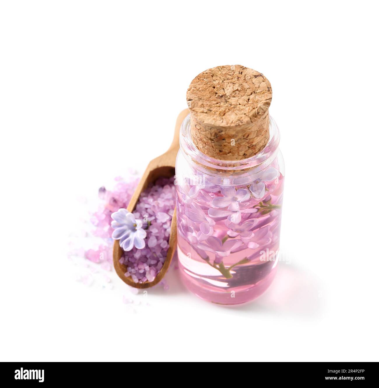 Bottle of cosmetic oil with beautiful lilac flowers and sea salt on ...