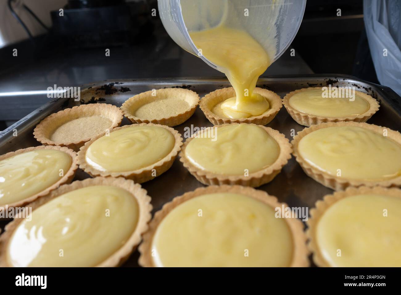 Zesty and irresistible - lemon tarts served on a metal tray, tempting ...