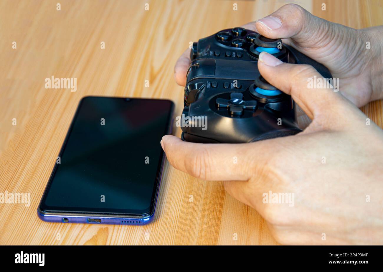 Side view of a joystick gaming device, holding a joystick Stock Photo ...