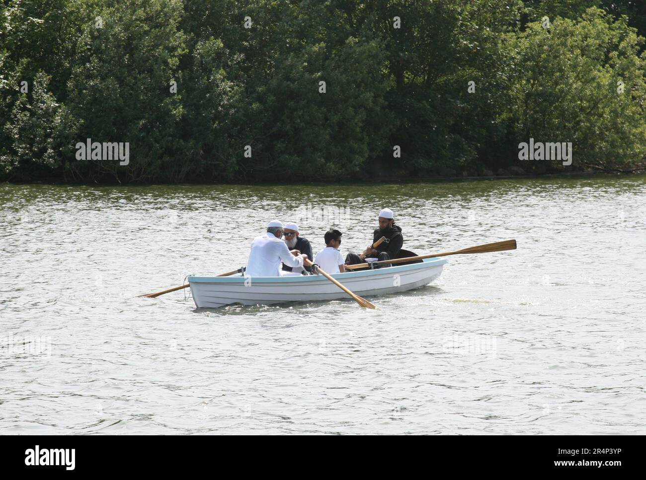 Four men in a rowing boat Stock Photo - Alamy
