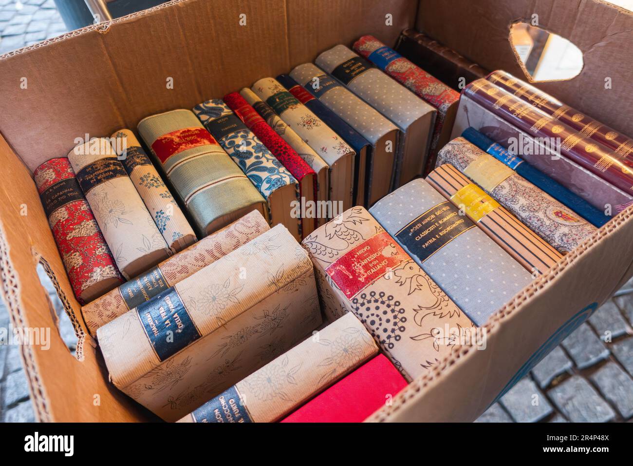 Box full of old used books, flea market. Vintage books with decorated ...