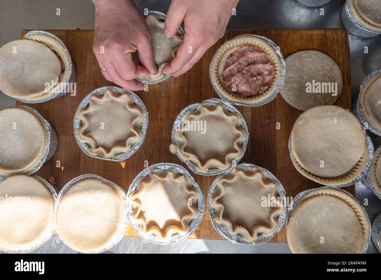 Discover the art of crafting a delicious Pork Pie: Expert hands ...