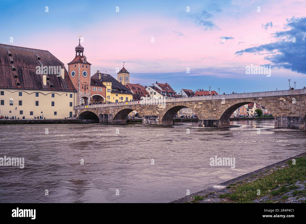 Old medieval stone bridge and historic old town in Regensburg, Germany ...