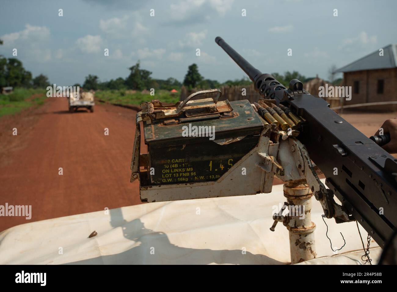 A United Nations peacekeeping convoy operates on a dirt road in DRC ...
