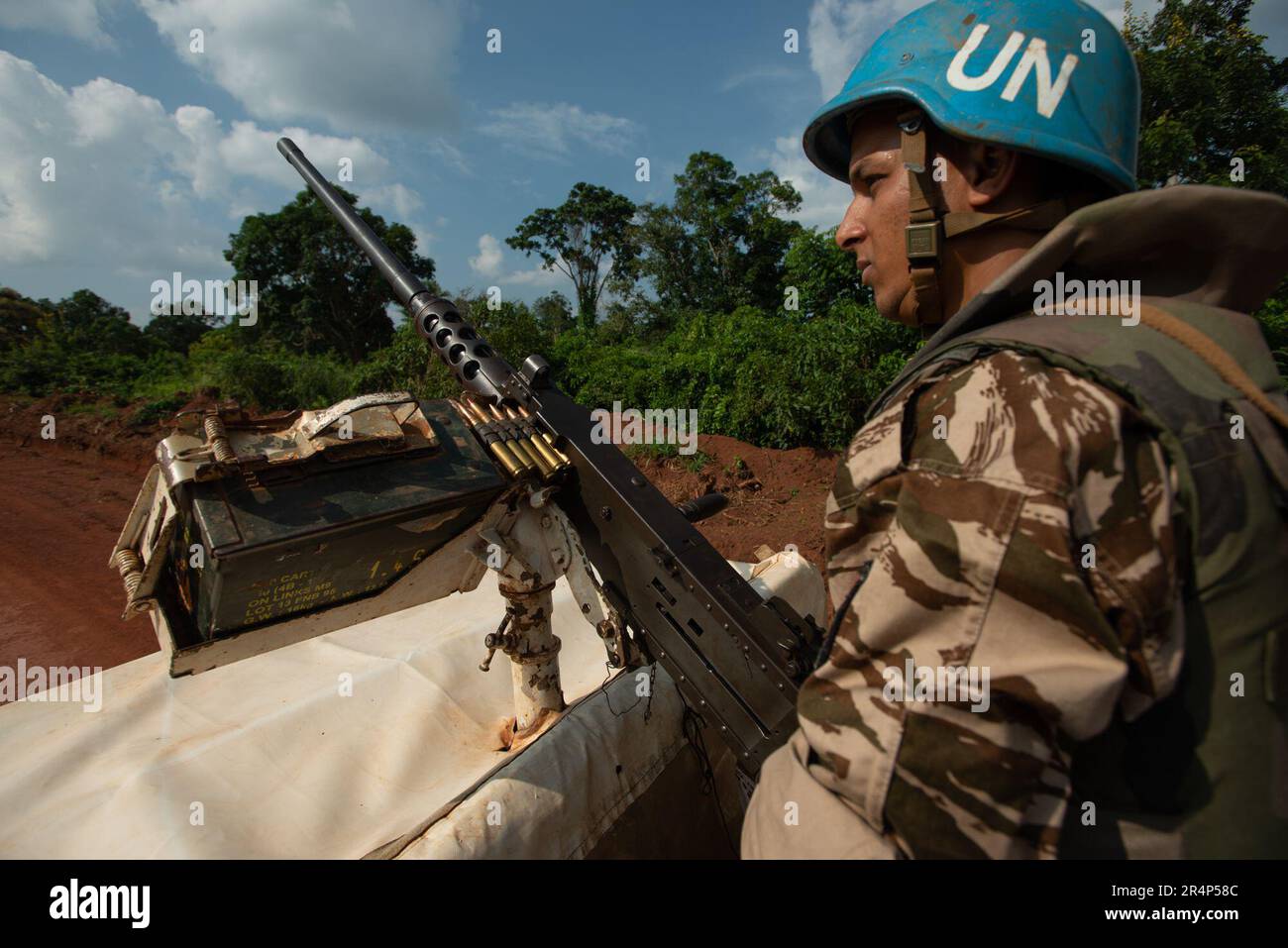 A United Nations peacekeeping convoy operates on a dirt road in DRC ...