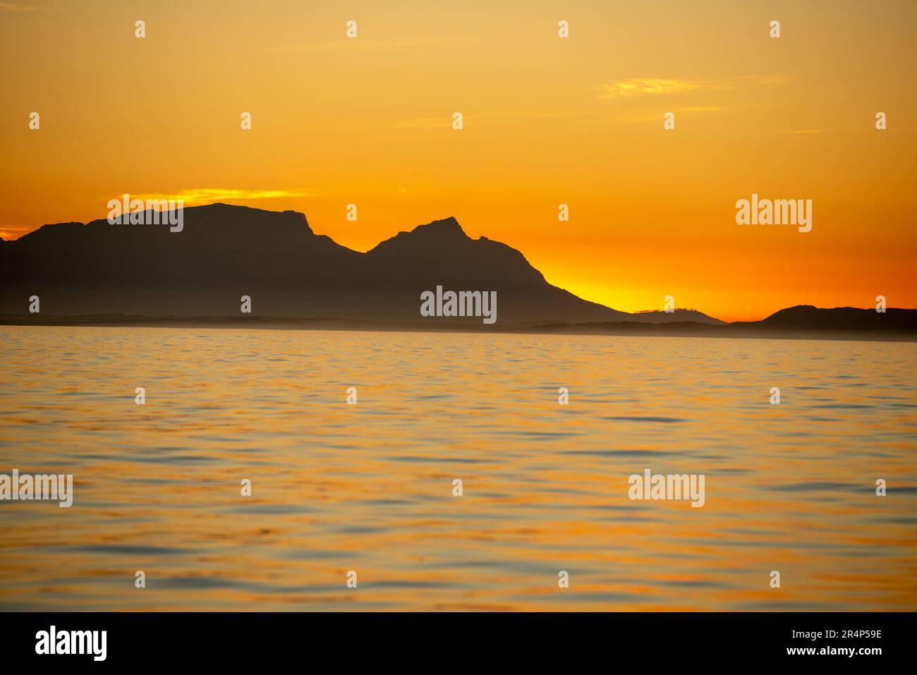 Table mountain and Devils Peak at sunset, from False Bay Stock Photo ...