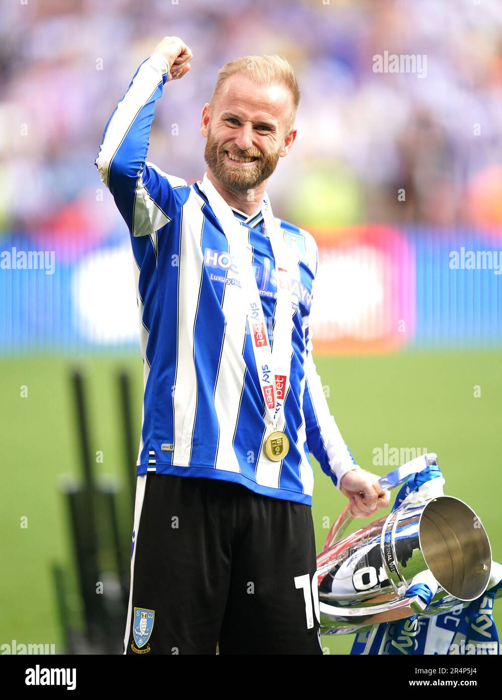 Sheffield Wednesday's Barry Bannan celebrates with the trophy following ...