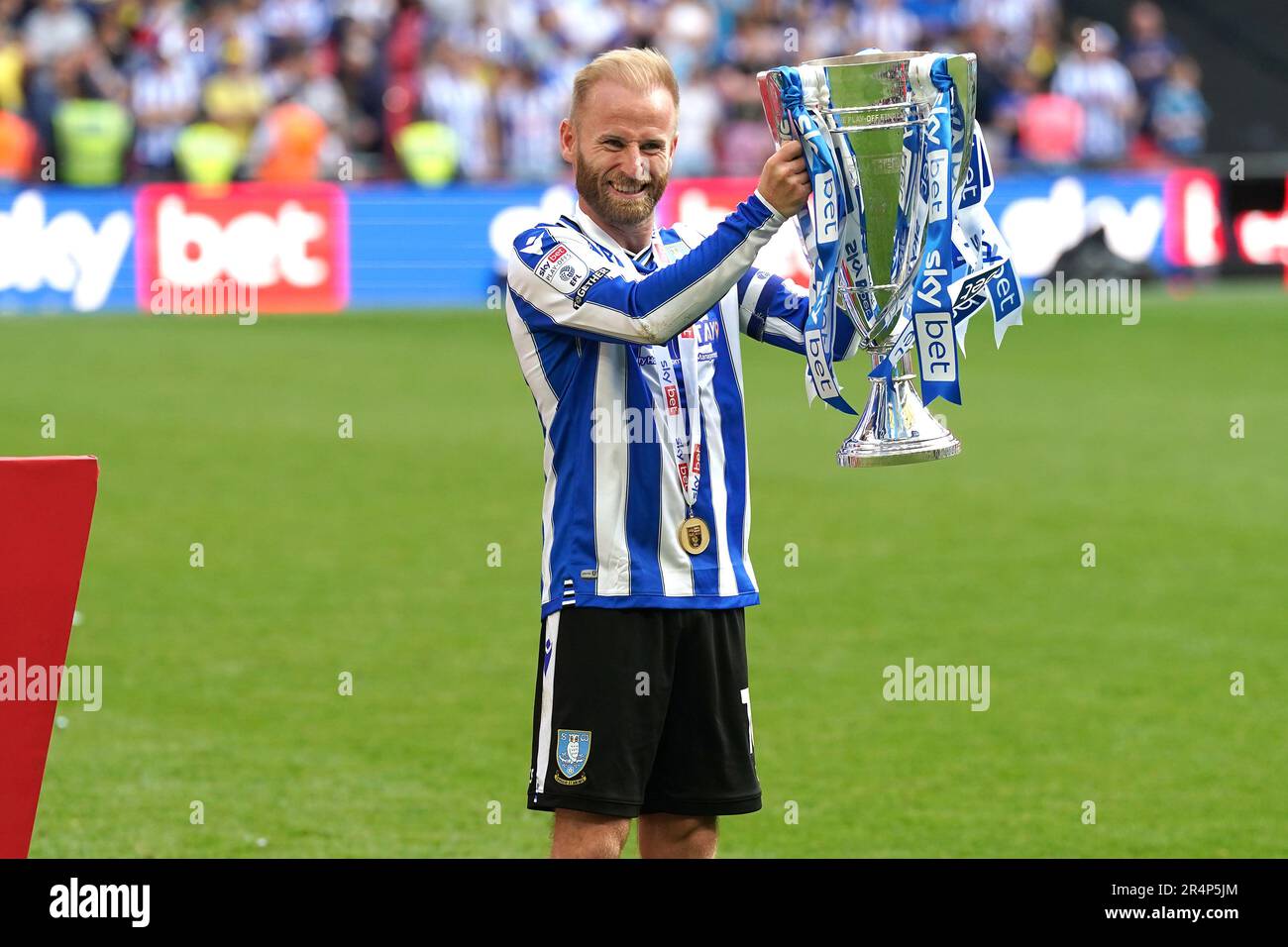 Sheffield Wednesday's Barry Bannan celebrates with the trophy following ...