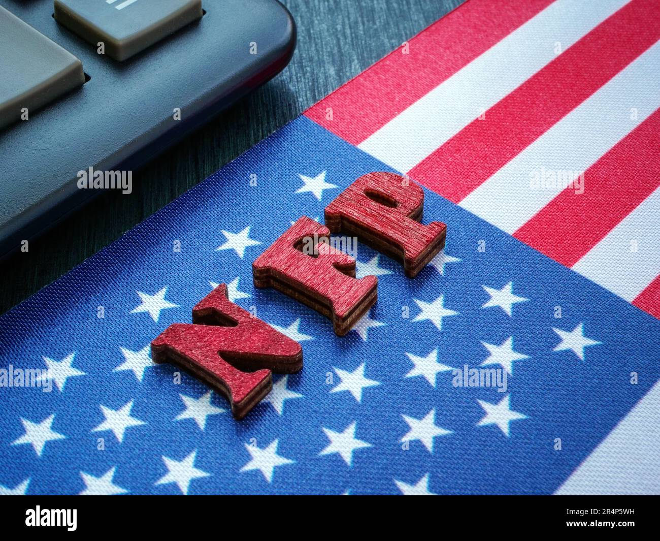 USA flag and letters NFP Nonfarm Payrolls on it Stock Photo - Alamy