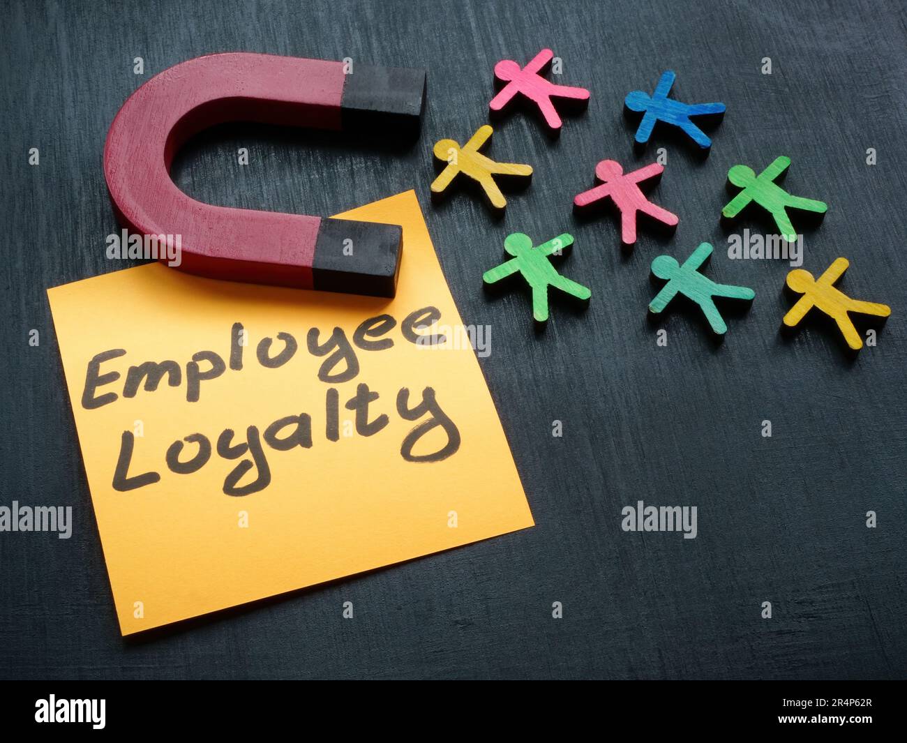 Memo stick with sign employee loyalty, magnet and figurines Stock Photo ...