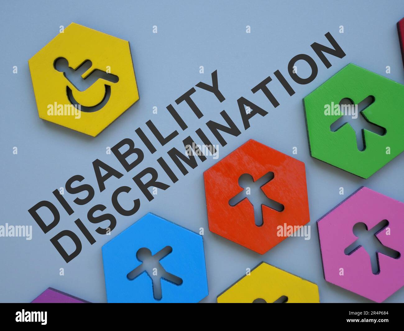 Small colorful figurines and inscription disability discrimination ...